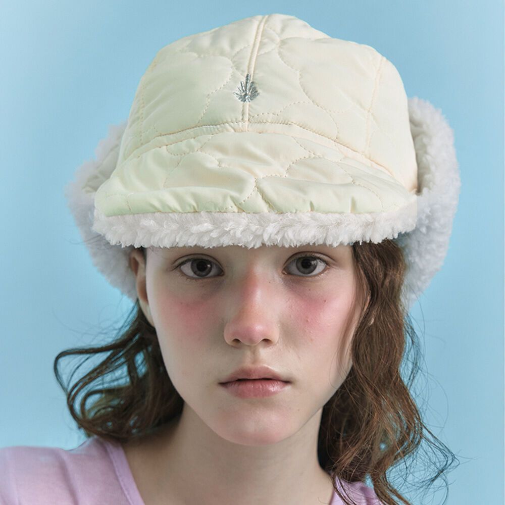 PADDING EARFLAP HAT IN CLOVER BUTTER - 감도 깊은 취향 셀렉트샵 29CM